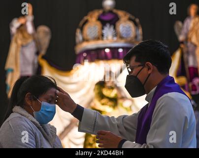 Cardinal Álvaro Ramazzini makes the sign of the cross with ashes on the ...