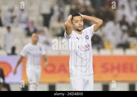 Rodrigo Tabata (12) of Al Sadd on the ball as Sandro Manoel (55) of Al ...