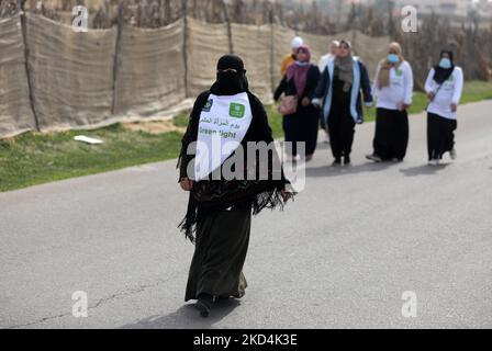 Palestinian women walk together marking International Women's Day, in ...