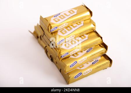 Stack of McVities Gold Bars in rough pile - multiple golden chocolate ...