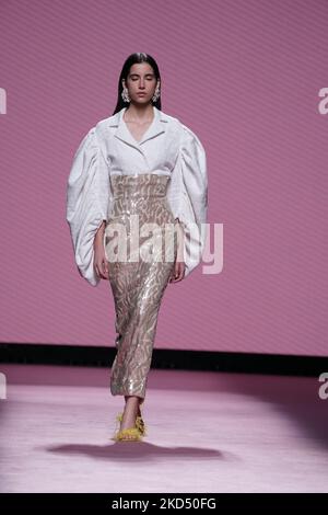 Model walks the runway at the Redondo Brand fashion show during ...