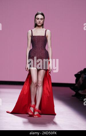 Model walks the runway at the Redondo Brand fashion show during ...