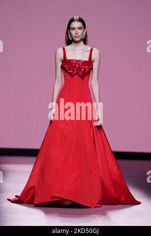 Model walks the runway at the Redondo Brand fashion show during ...