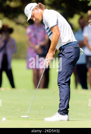 Harrison Crowe (A) of Australia plays his 2nd shot on the 1st hole ...