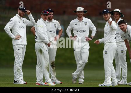 Durham players congregate after taking a wicket during the Friendly ...