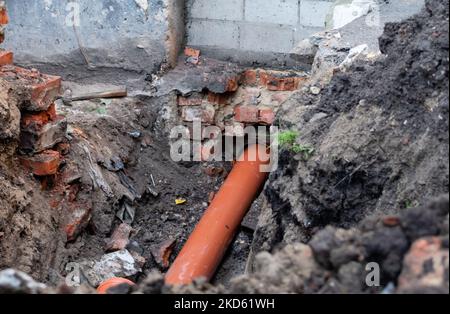 Repair of sewer drain with strong plastic pipe of large diameter in ...