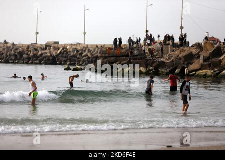 Palestinians enjoy a summer day at the beach of Gaza City, Saturday ...