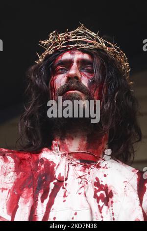 An actor dressed as Jesus Christ attends the Way of the Cross during ...