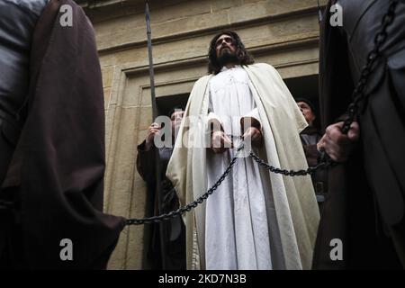An actor dressed as Jesus Christ attends the Way of the Cross during ...