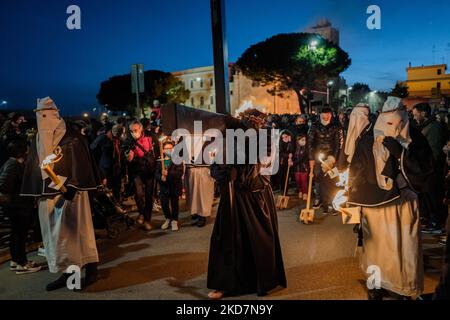 The first crucifer in procession with a heavy cross on his shoulders in ...