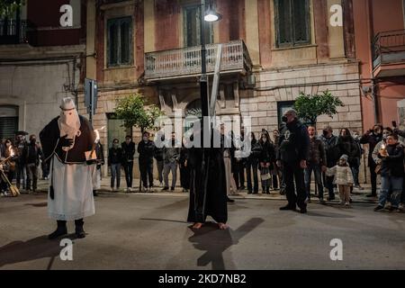 The first crucifer makes a bow in front of a tomb in Noicattaro on ...