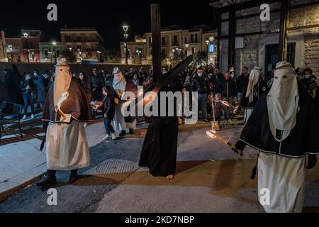 The first crucifer in procession with a heavy cross on his shoulders in ...
