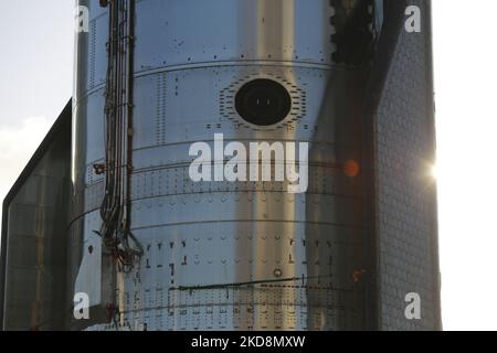Starship 22 stands behind the build site at SpaceX's South Texas campus ...