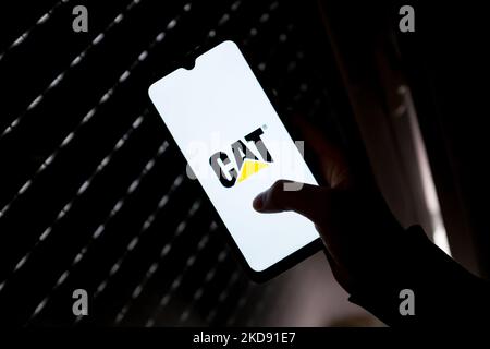 In this photo illustration, Caterpillar Inc. logo seen displayed on a ...