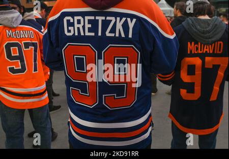 Edmonton Oilers captain Connor McDavid, left, signs autographs for fans ...