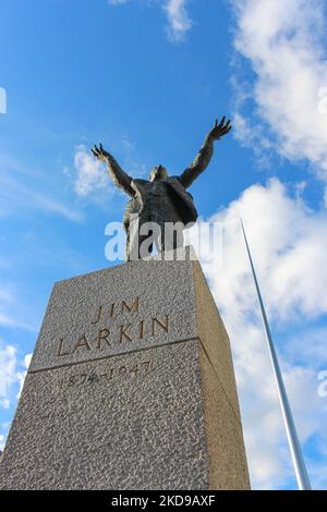 A low angle shot of Jim Larkin Sculpture rear view against a blue sky ...