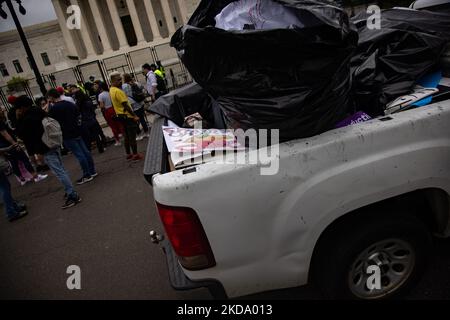 Protestors march past the Supreme Court on Wednesday, Nov. 5, 2025, in ...