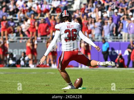 Texas Tech place kicker Trey Wolff, second from left, kicks the game ...