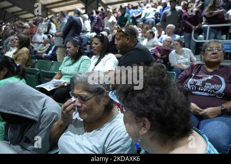 Mourners comfort eachother and pray at a vigil for the 21 killed at ...