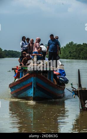 Residents are seen riding water transportation at the Batang Buluh pier ...
