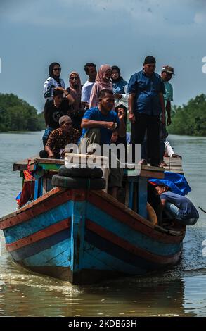 Residents are seen riding water transportation at the Batang Buluh pier ...