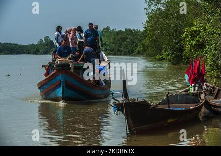 Residents are seen riding water transportation at the Batang Buluh pier ...