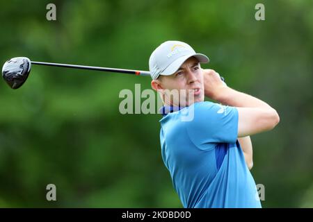 Matthew Fitzpatrick, of England, hits his tee shot on the 13th hole ...