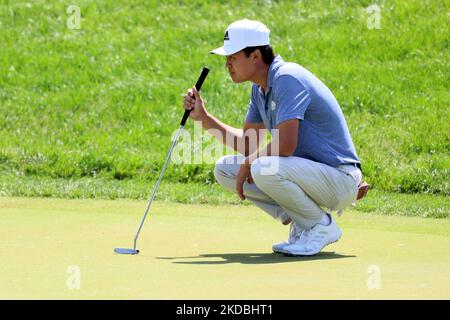 Brandon Wu lines up a putt on the second hole during the first round of ...