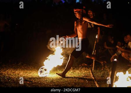 Villagers playing fire football, known locally as "sepak bola api", a ...