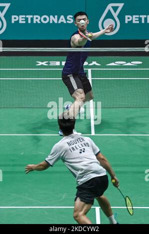 Nhat Nguyen (Ireland) competes against Koki Watanabe (Japan) in men's ...