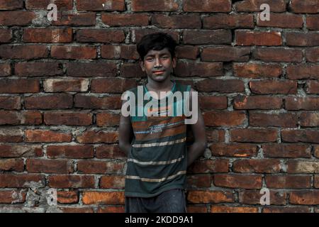 A child works inside a kitchen utensils factory at Shyampur in Dhaka ...