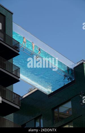 Swimmers hang in space at the Sky Pool, Embassy Gardens, Battersea ...