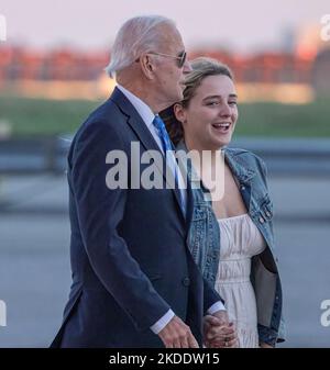 President Joe Biden walks with his granddaughter Finnegan Biden to ...