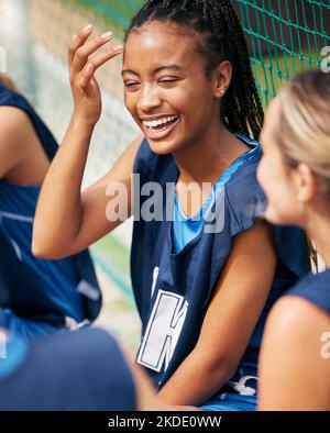 Netball, team and friends laughing together, women on outdoor court and ...