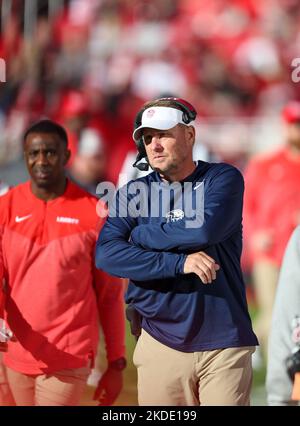 Liberty head coach Hugh Freeze watches as players warm up prior to an ...