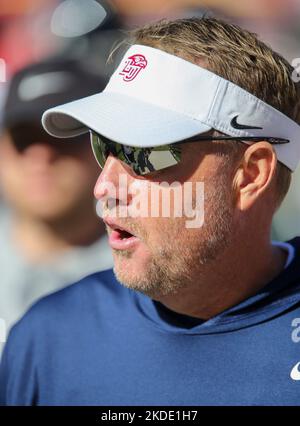 Liberty head coach Hugh Freeze watches as players warm up prior to an ...