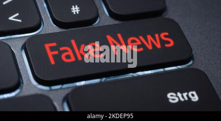 Illuminated keyboard with a labeled key - Fake News Stock Photo - Alamy