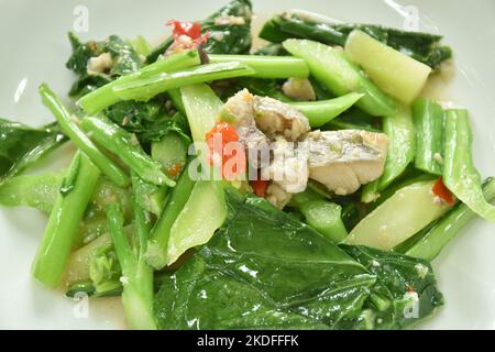 fried Chinese kale with chop salty fish in oyster sauce on plate Stock ...