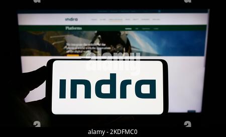 Smartphone with logo of Spanish company Indra Sistemas S.A. on screen ...
