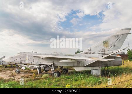 Old jet plane stands at an abandoned airfield Stock Photo - Alamy