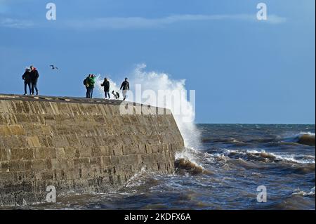 Lyme Regis, UK. 06th Nov, 2022. ON a very windy afternoon with mixed ...