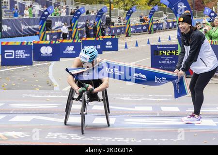 Susannah Scaroni of the United States crosses the line in second place ...
