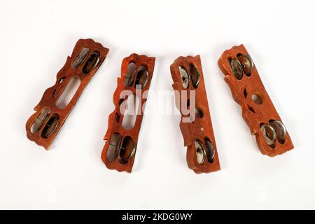 Wooden Khartals, idiophone with jingles in a wooden frame. Folk ...