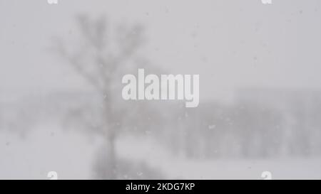 snow falling with blurred bacground, wide photo Stock Photo - Alamy