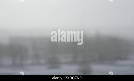 snow falling with blurred bacground, wide photo Stock Photo - Alamy