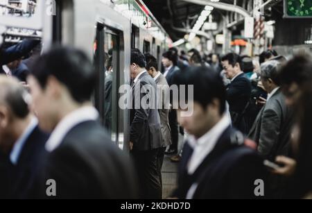 Subway commuter businesswoman in mask on public transport using ...