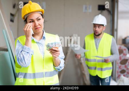 Woman engineer crying, disappointed by low salary Stock Photo - Alamy