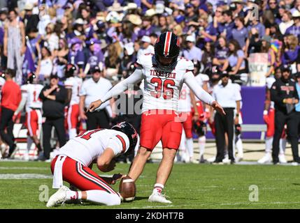 Texas Tech place kicker Trey Wolff, second from left, kicks the game ...