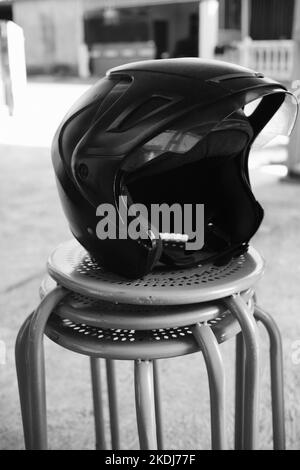 Photo of engineer helmet in a plastic trash bin Stock Photo - Alamy
