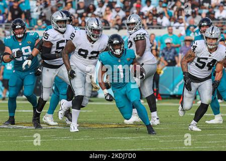 Jacksonville Jaguars running back Travis Etienne Jr. carries against ...